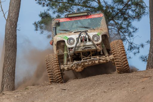 Off-road racing car covered with mud during National All Terrain ...