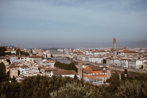 Aerial view of the medieval arch bridge of Ponte Vecchio over the Arno ...