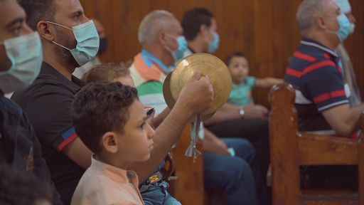 Egyptian people singing, clapping, and playing music, at a gathering in ...