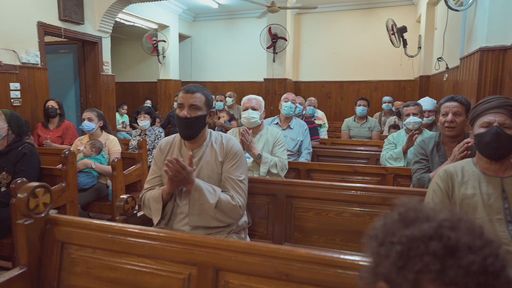 Egyptian people singing, clapping, and playing music, at a gathering in ...
