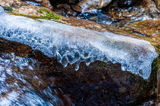 Ice in a river in Swiss Alps, The old canal lock of the Joux Verte ...