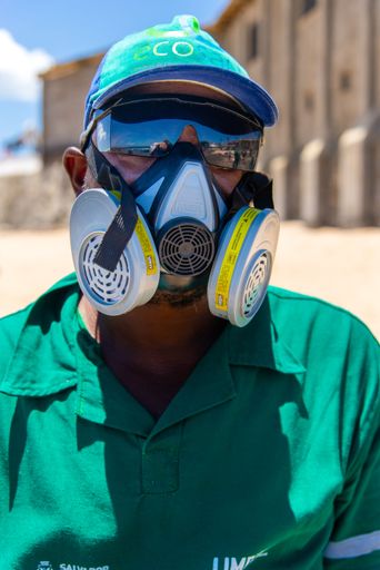 Cleaning agents extract oil from beach in the city. Using protec Stock ...