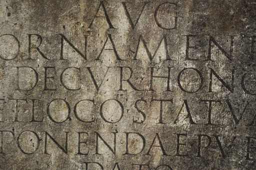 Closeup of ancient roman letters written on a stone background Stock ...