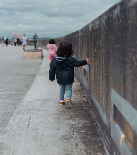 Yann | Children walking outside on a cloudy day